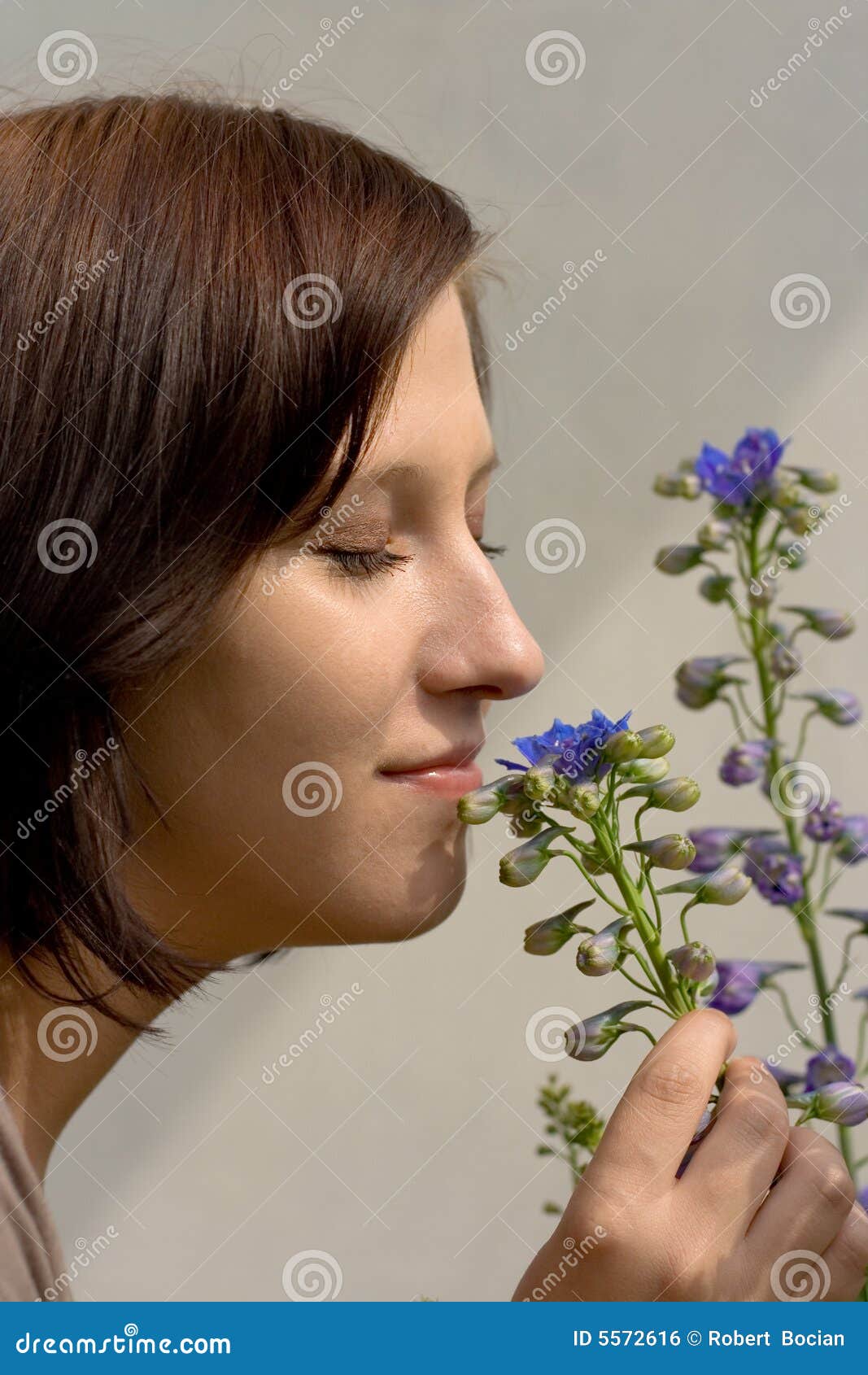 Flower smelling stock photo. Image of people, elegance - 5572616
