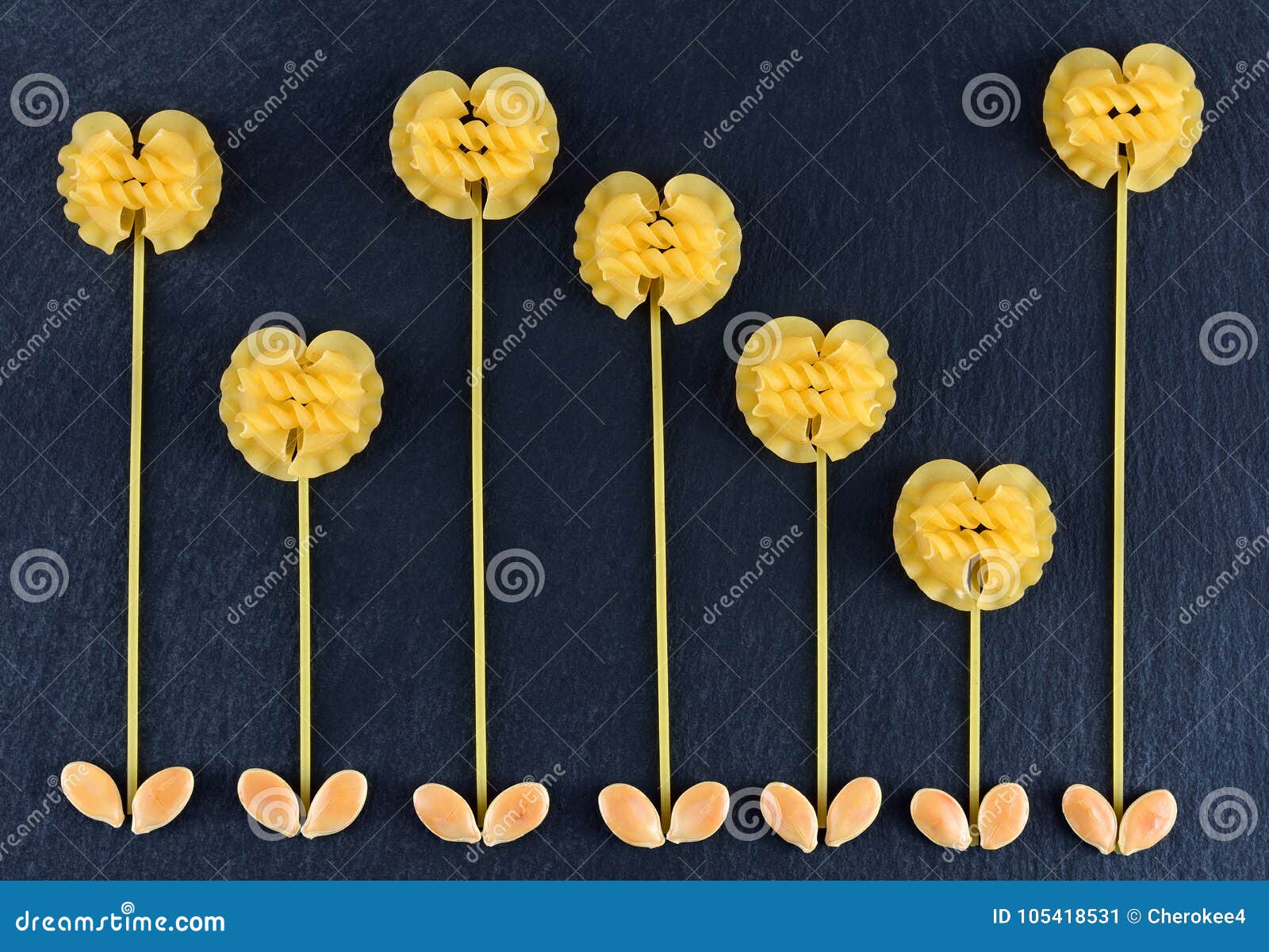 Flowers Made Out of Various Pasta on the Dark Slate Background, Topview ...