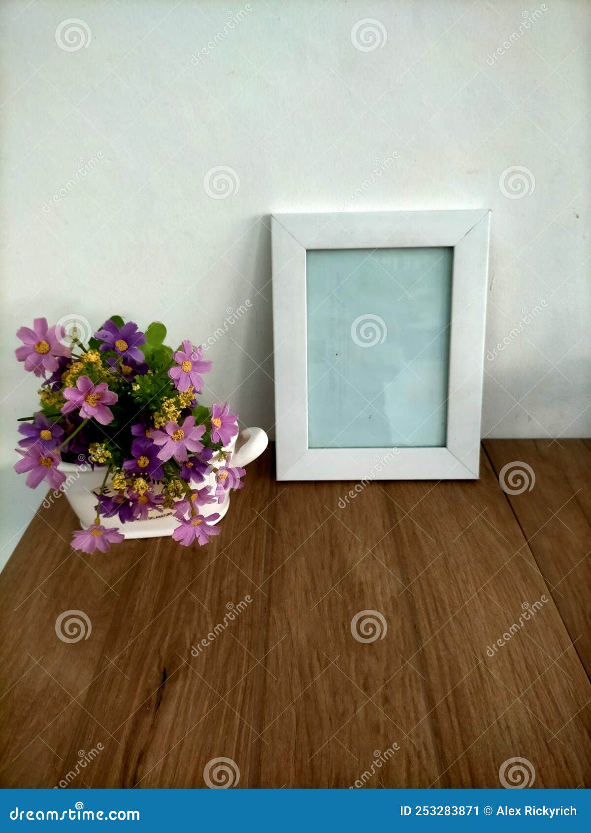 Flowers and Photo Frame on the Table Stock Image - Image of frame ...