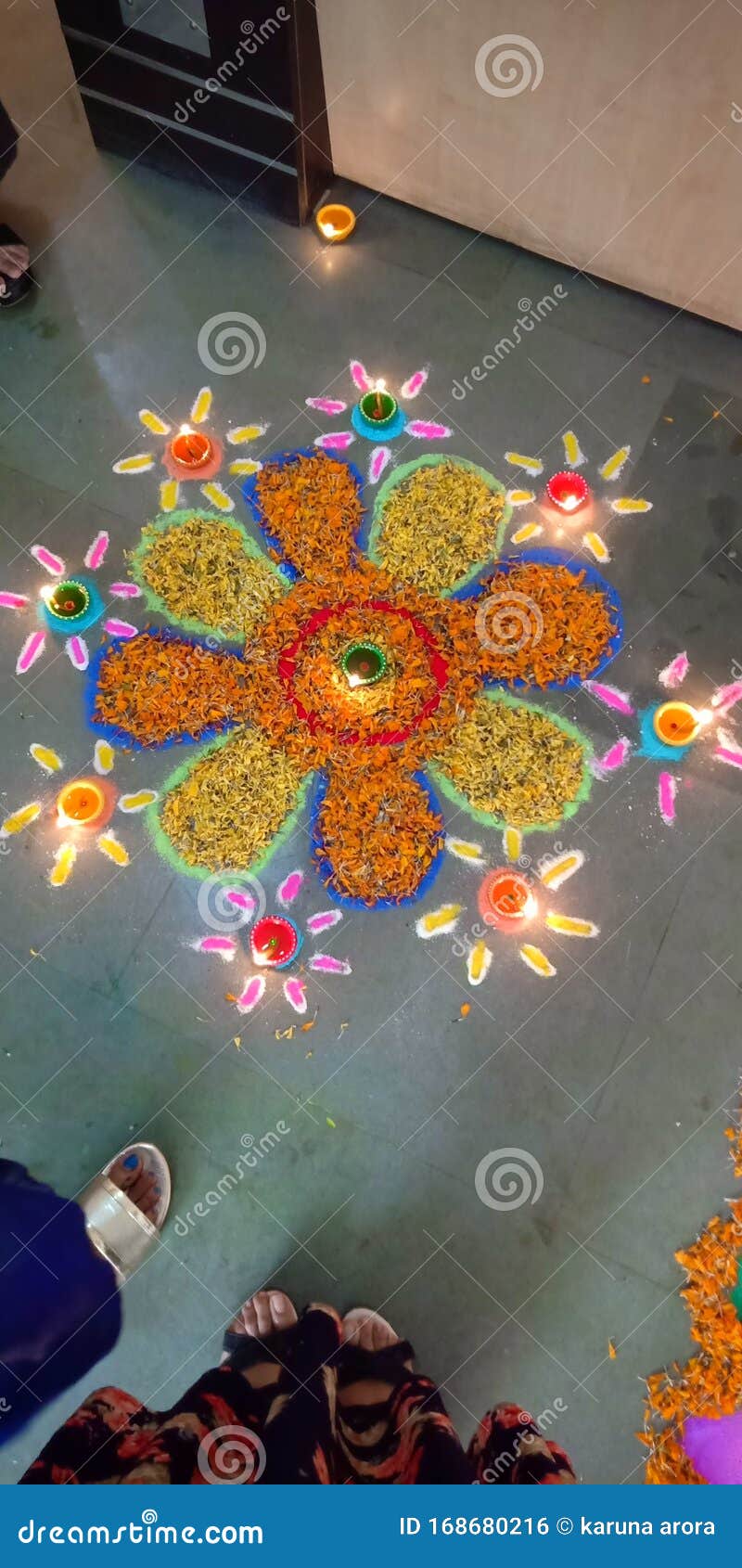 Flowers and Diya Rangoli stock photo. Image of celebration - 168680216