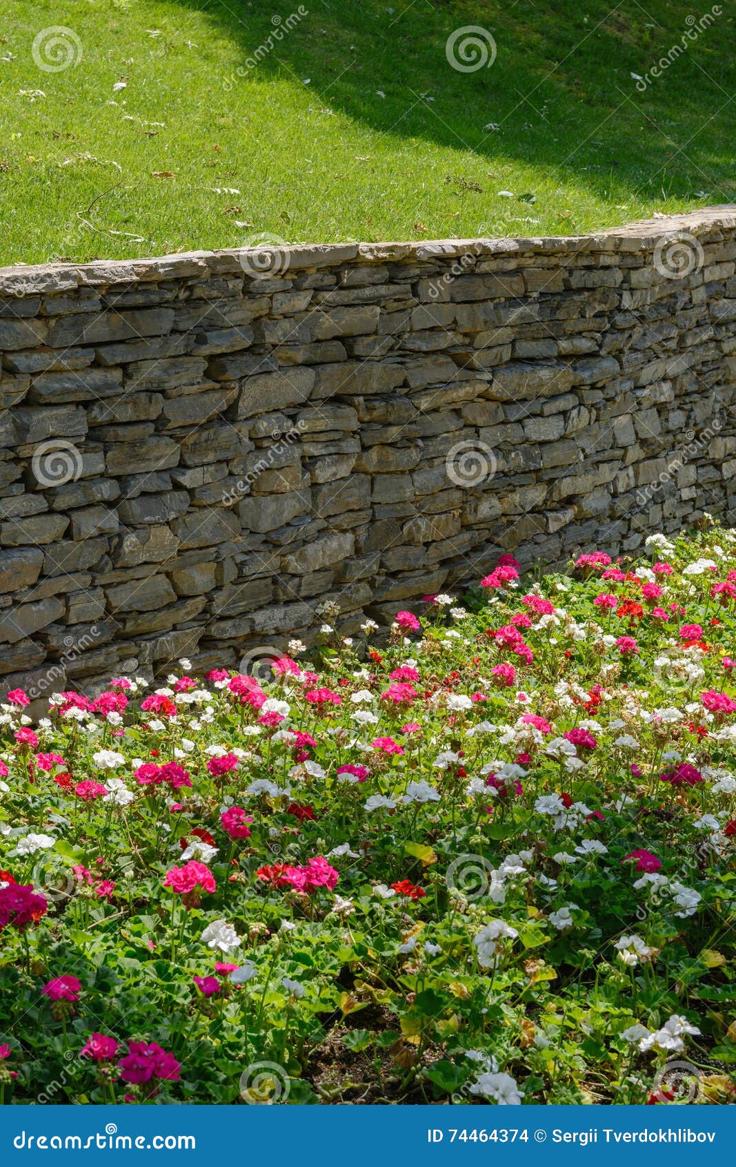 Flowers and Retaining Wall Brick Stock Photo - Image of decorative ...