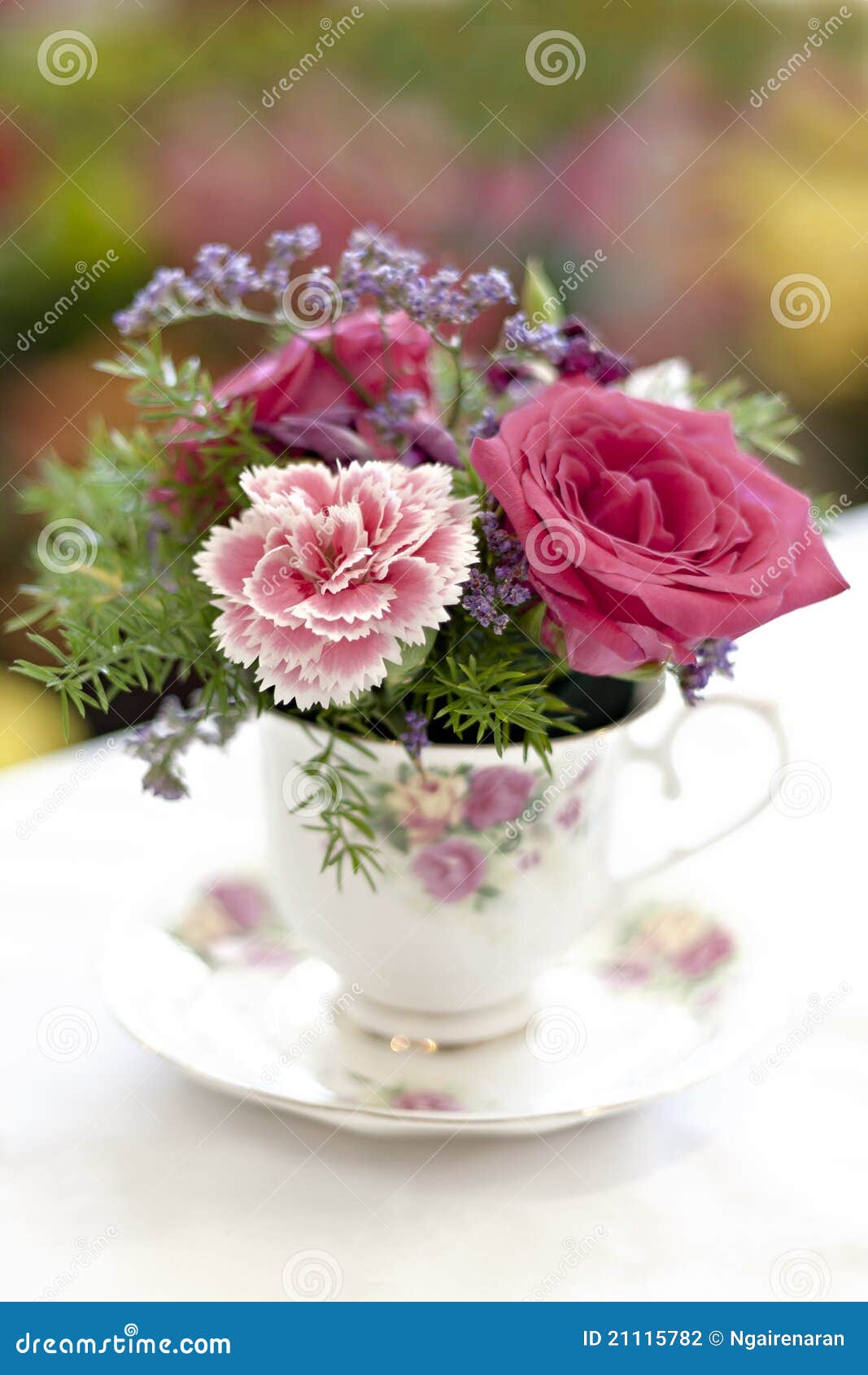 Flowers in a teacup stock photo. Image of floral, table - 21115782