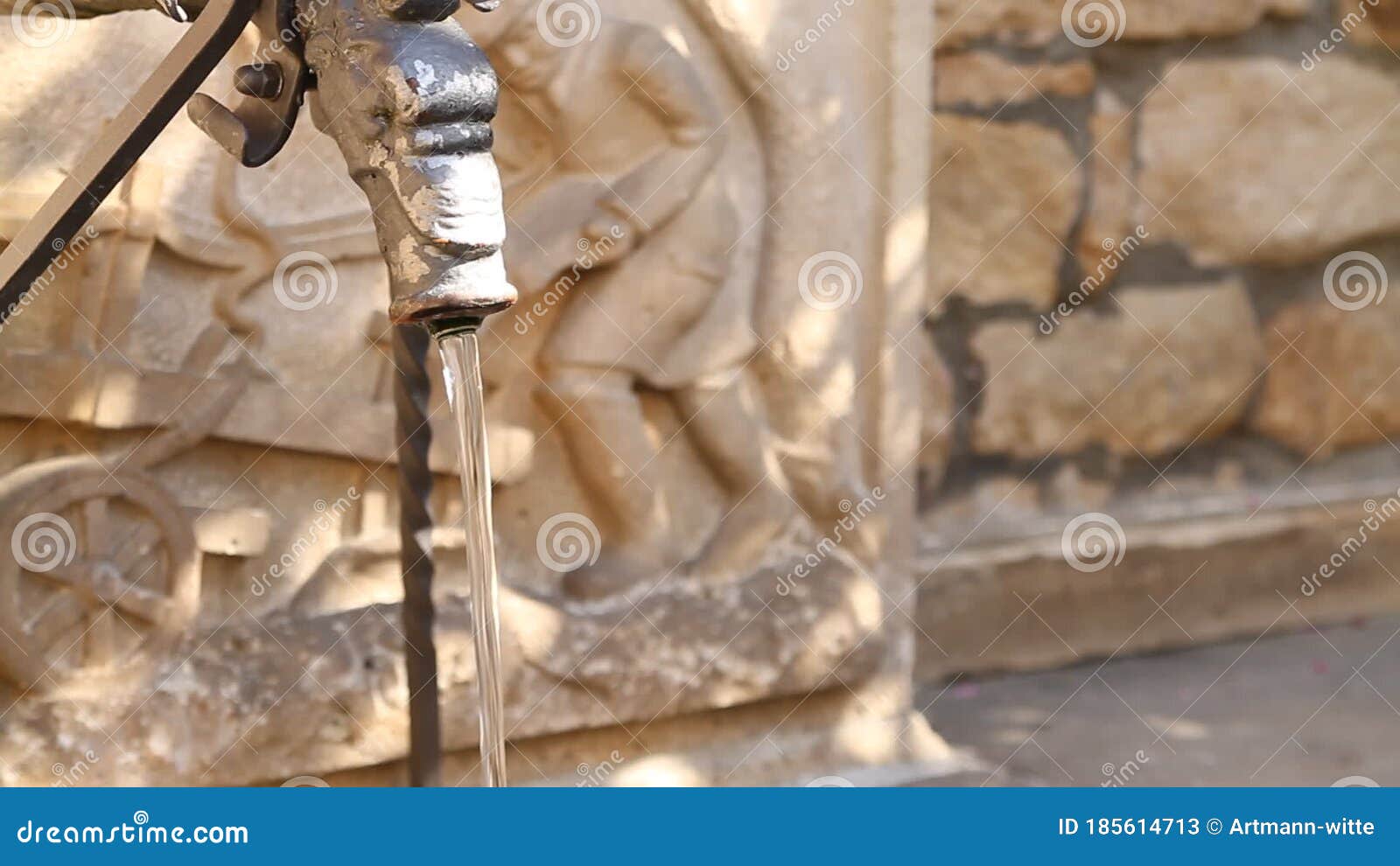 Flowing Drinking Water of an Ancient Fountain with Sculptures Stock ...