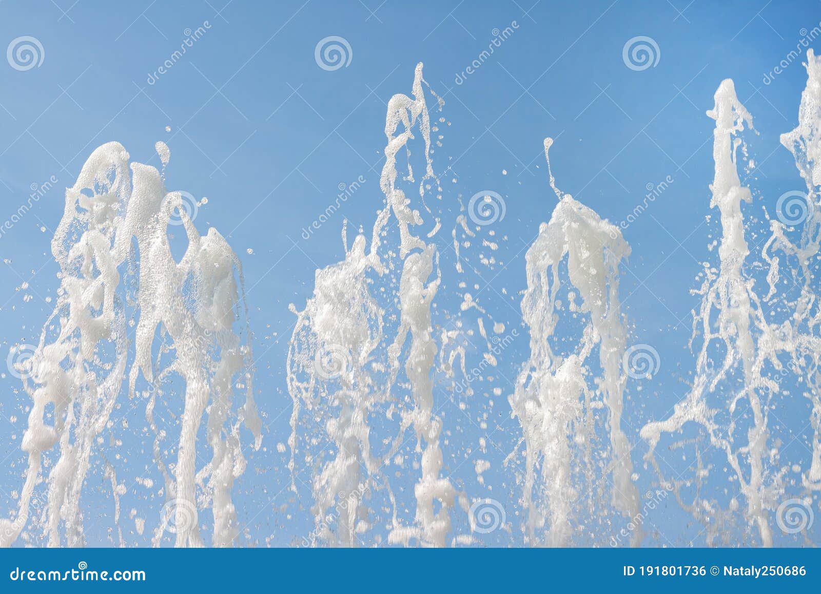 Flowing Fountain Water Spray Pattern with Blue Bright Sky Background ...