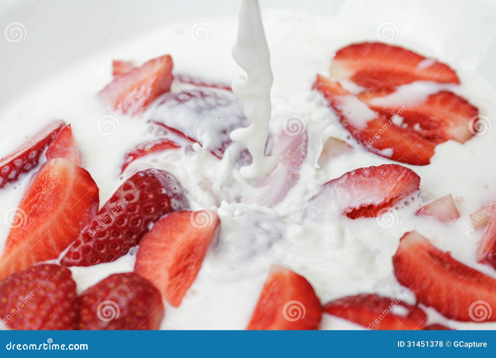 Flowing Milk Splashes on Sliced Strawberry Stock Photo - Image of ...