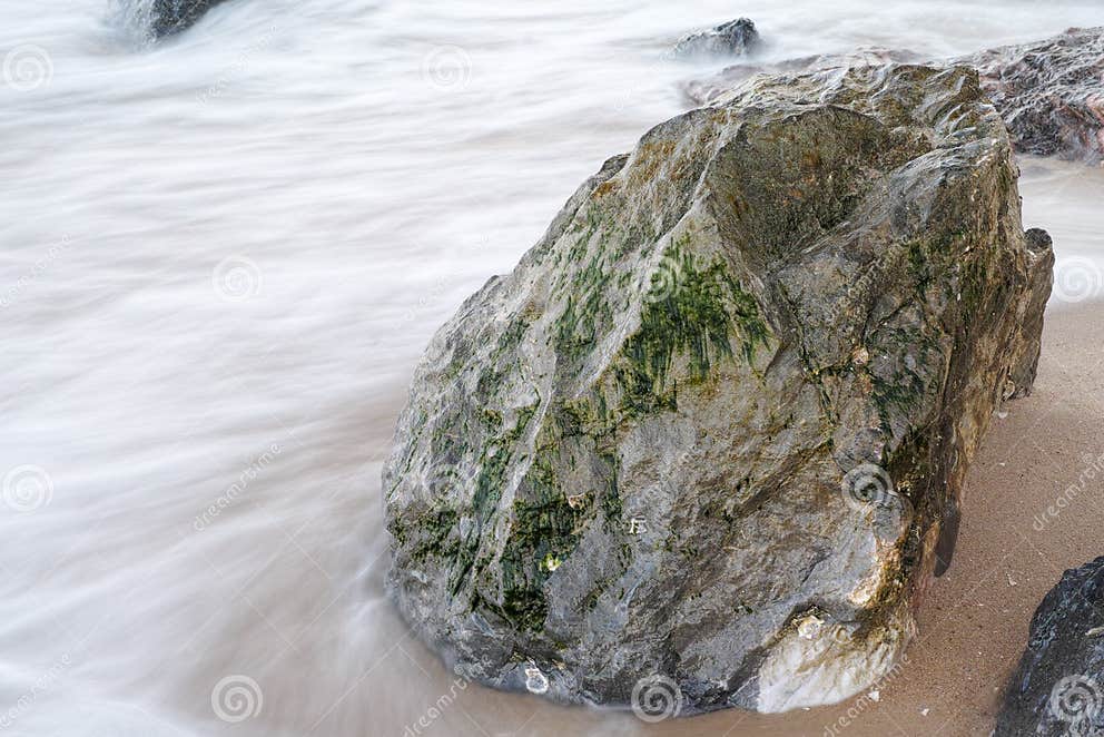 Flowing by the Rocks stock photo. Image of beach, stable - 64862658