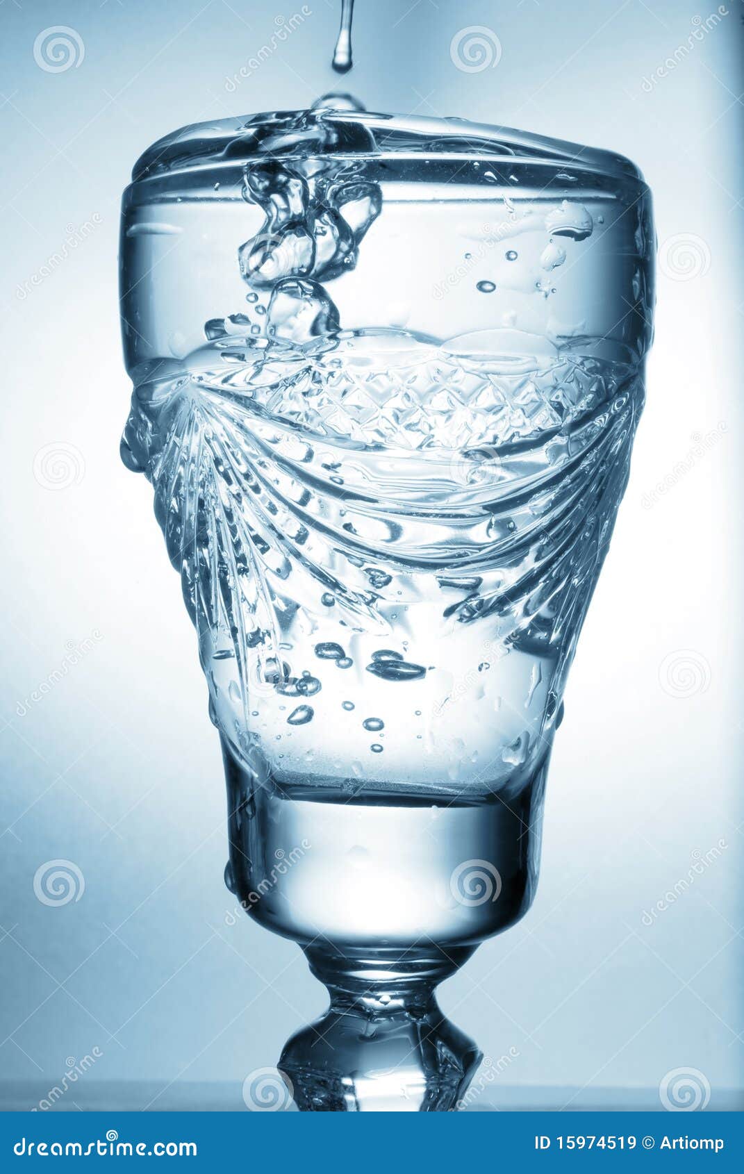 Flowing water in glass stock image. Image of vertical - 15974519