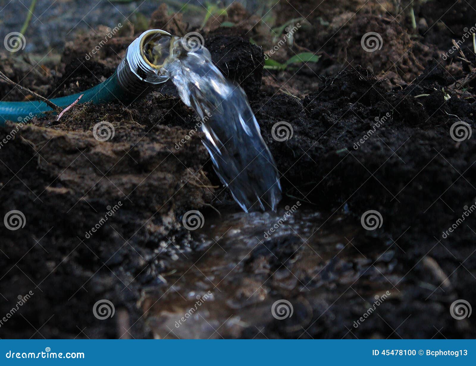 Flowing water hose stock photo. Image of soil, muddy - 45478100