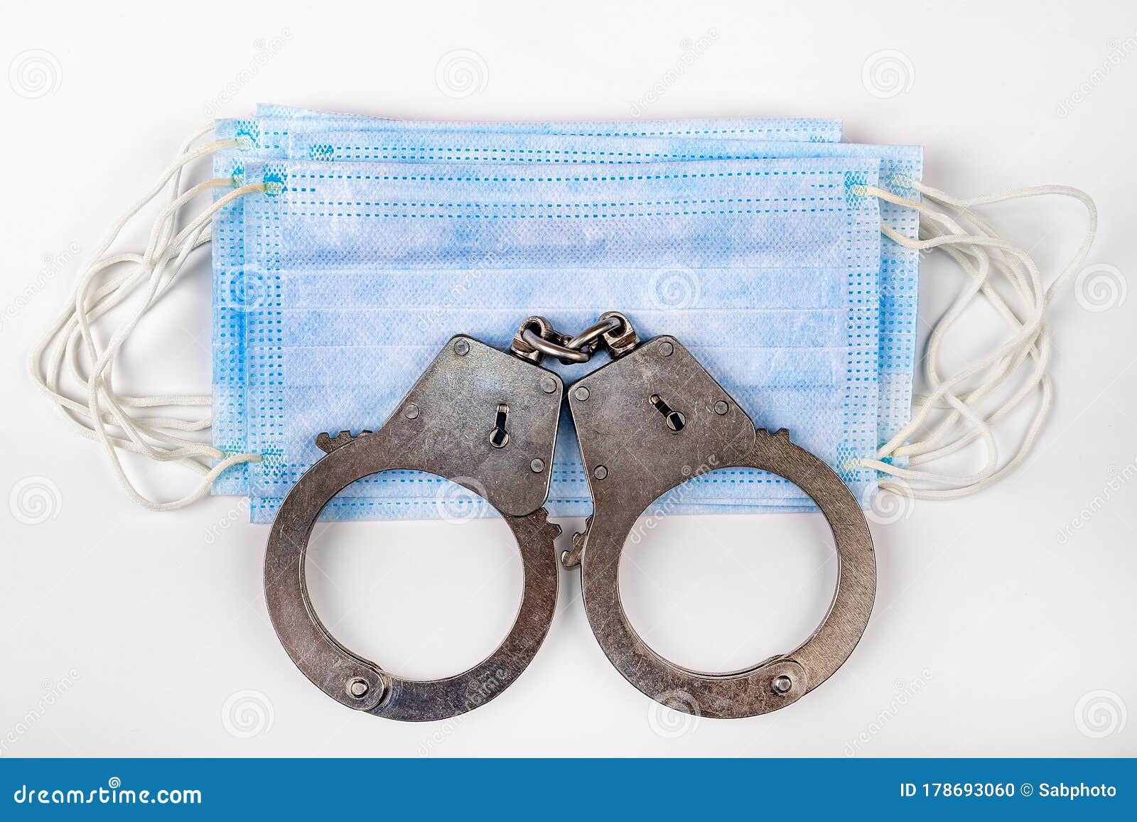 Flu Mask and Handcuffs stock photo. Image of manacles - 178693060