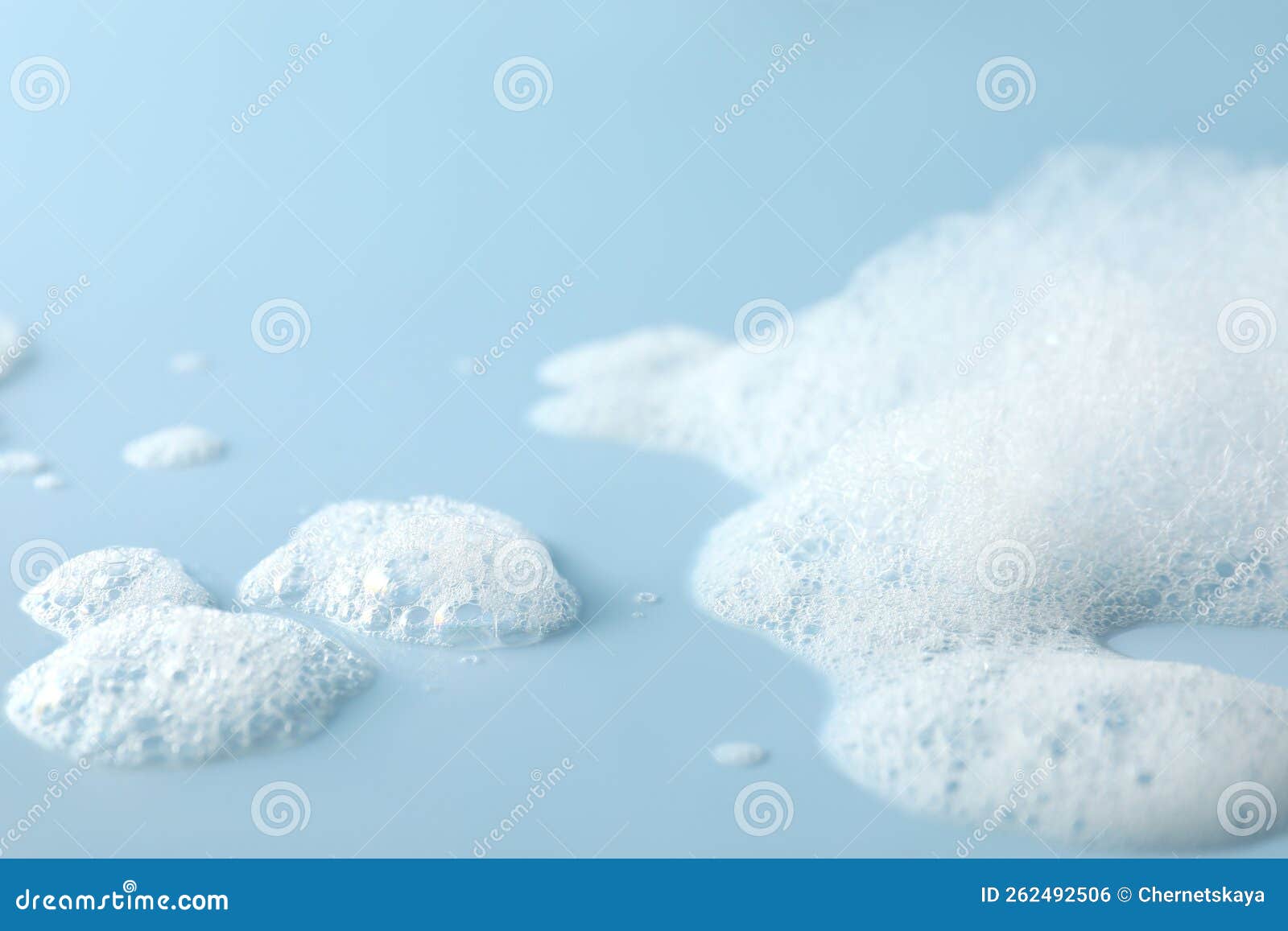 Fluffy Bath Foam on Light Blue Background, Closeup Stock Photo - Image ...