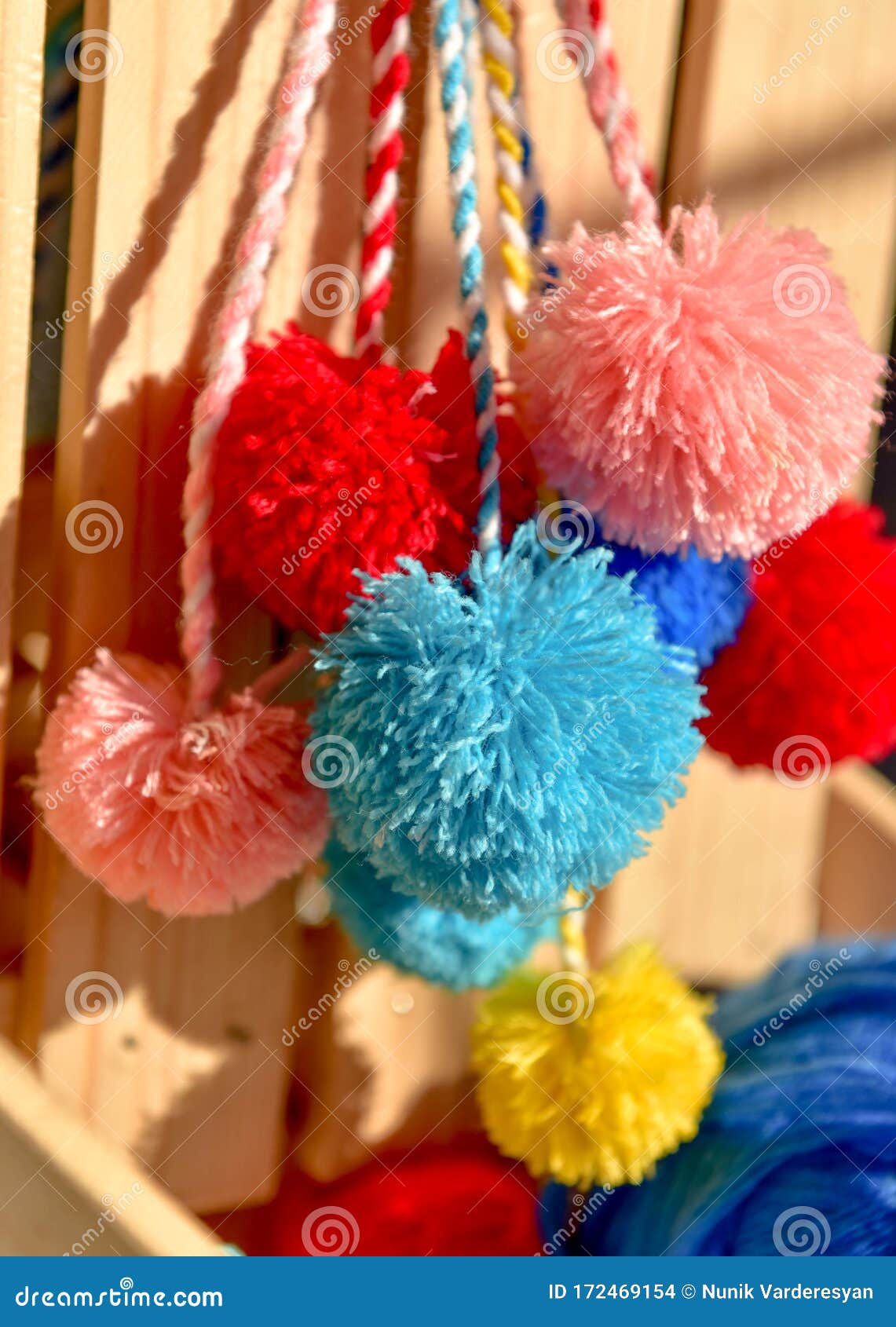 Fluffy Pom Poms with Multi-colored Threads. Stock Photo - Image of ...