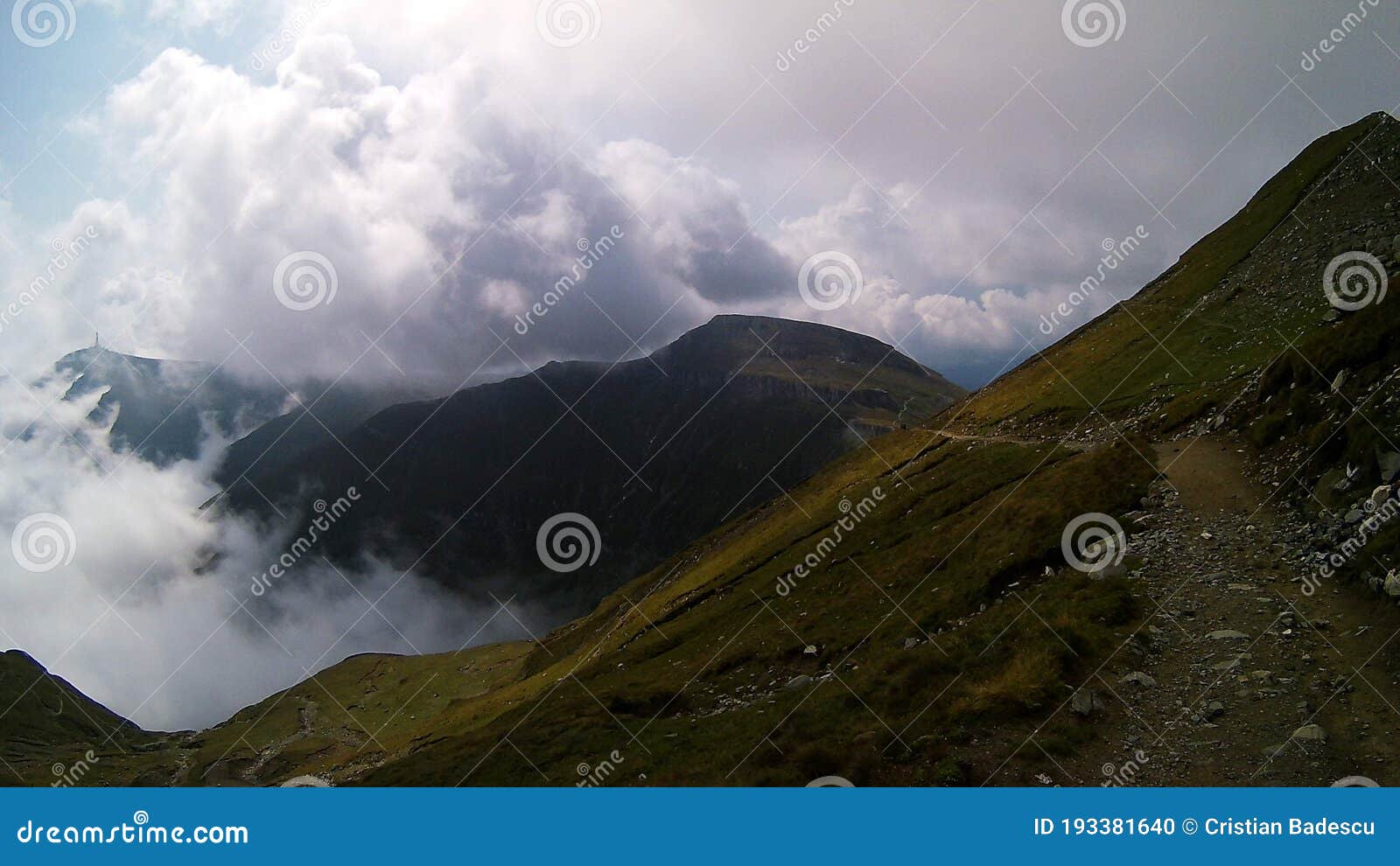 Fluffy White Clouds among the Mountain Ridges. Mist at High Altitude ...