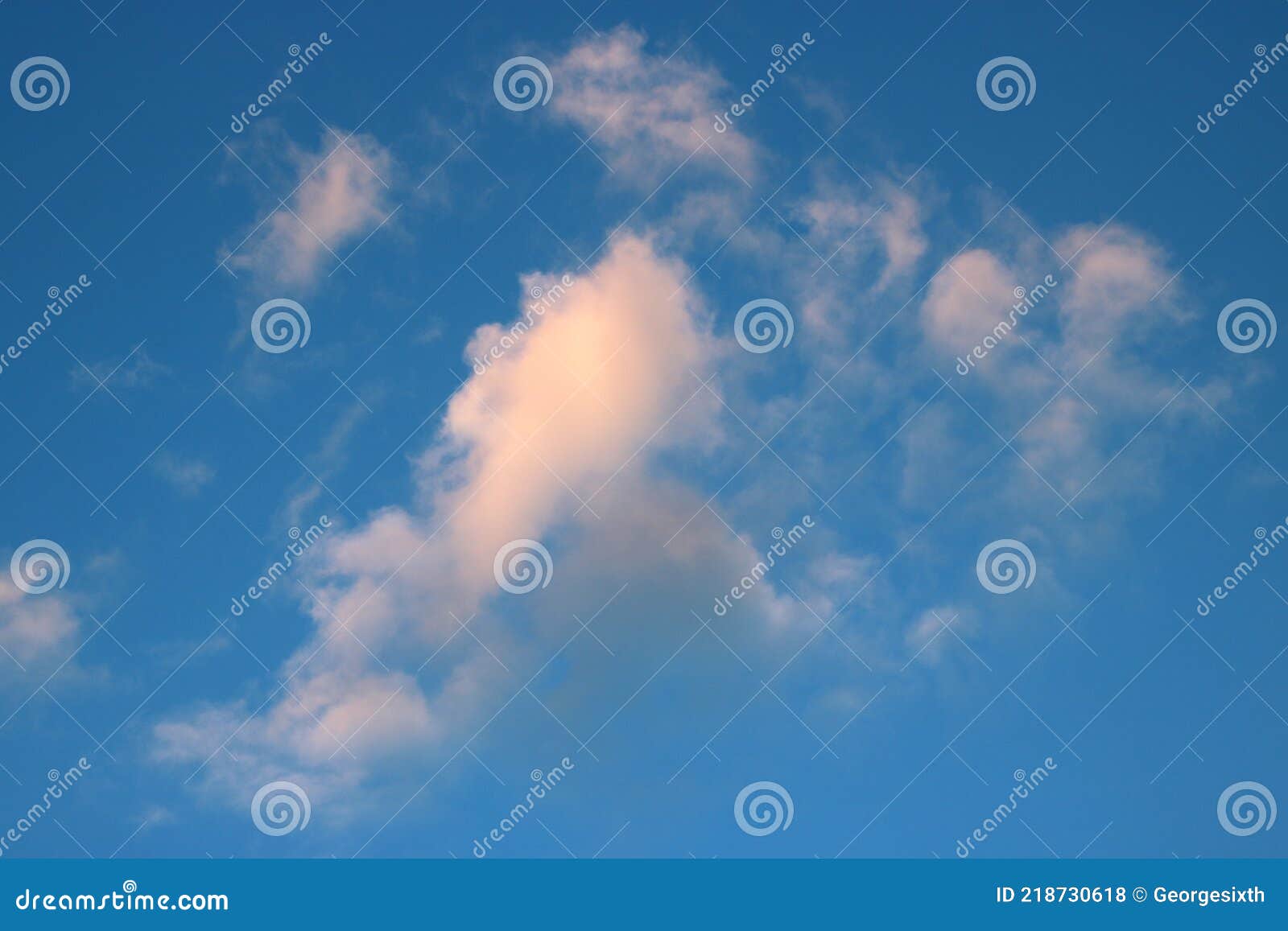 Fluffy, Wispy White Clouds Tinged Pink at Sunset Stock Photo - Image of vapor, fluffy: 218730618