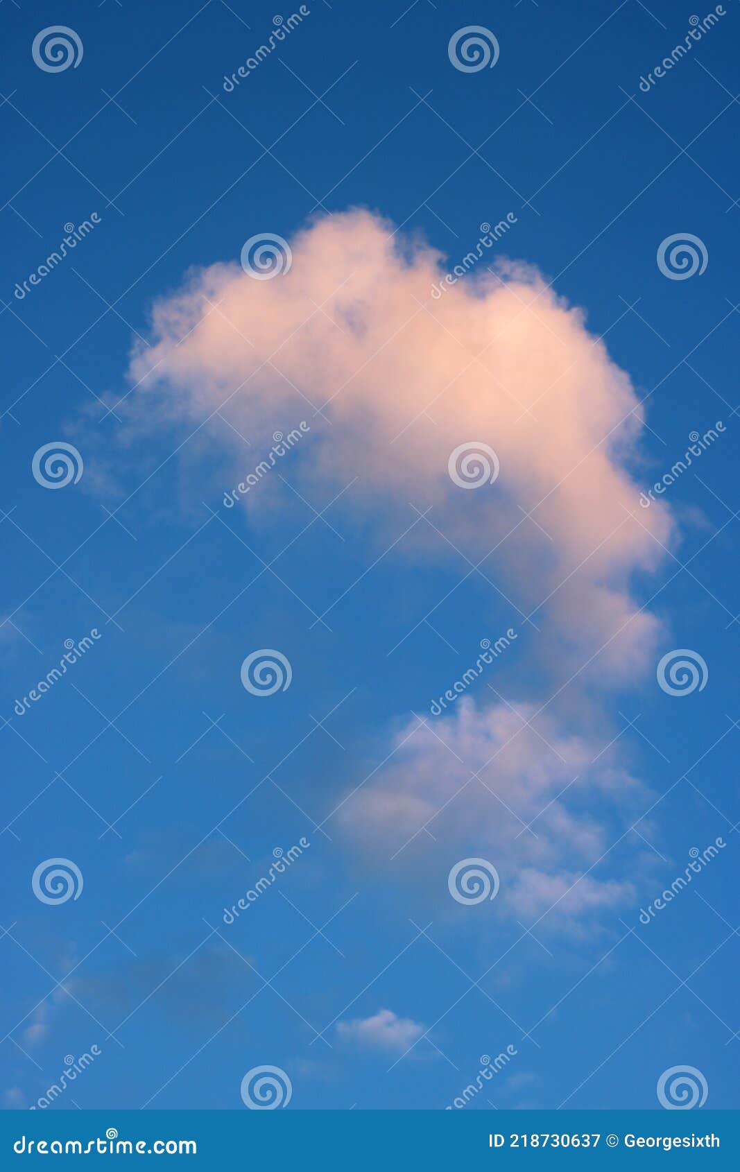 Fluffy, Wispy White Clouds Tinged Pink at Sunset Stock Image - Image of ...