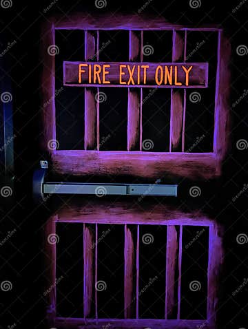 Fluorescent Glowing Fire Exit only Door Sign Stock Photo - Image of ...