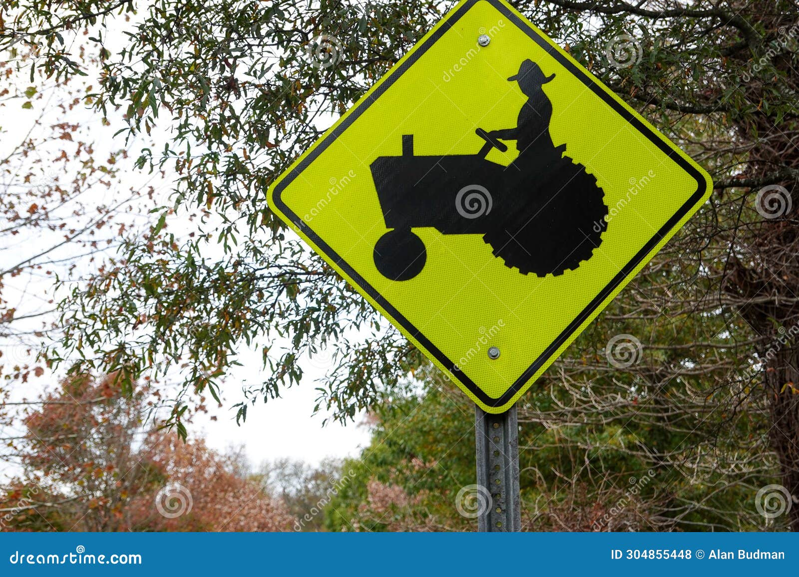 Fluorescent Green Triangular Yield Sign with the Silhouette of a Farmer ...