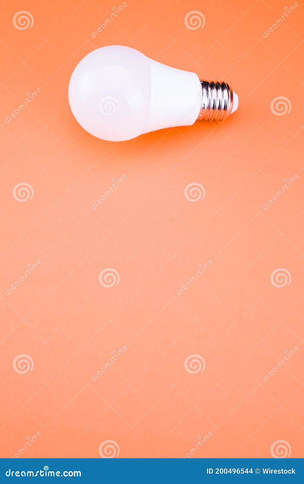 Fluorescent Light Bulb on the Orange Surface Stock Photo - Image of ...