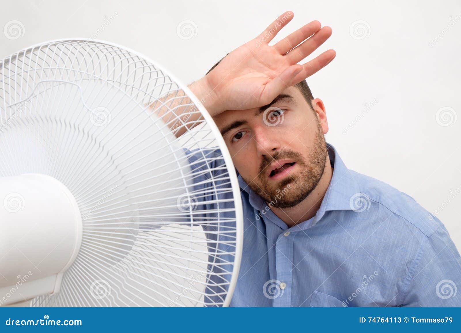 Flushed Man Feeling Hot in Front of a Fan Stock Image - Image of ...