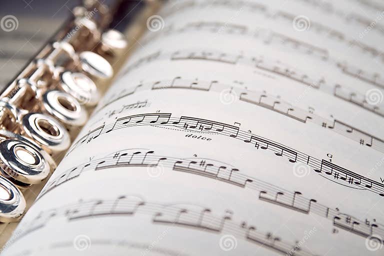 A Flute Rests Inside a Musical Score Stock Photo - Image of bach ...