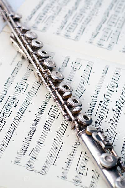 A flute on sheet music stock photo. Image of music, band - 2373586