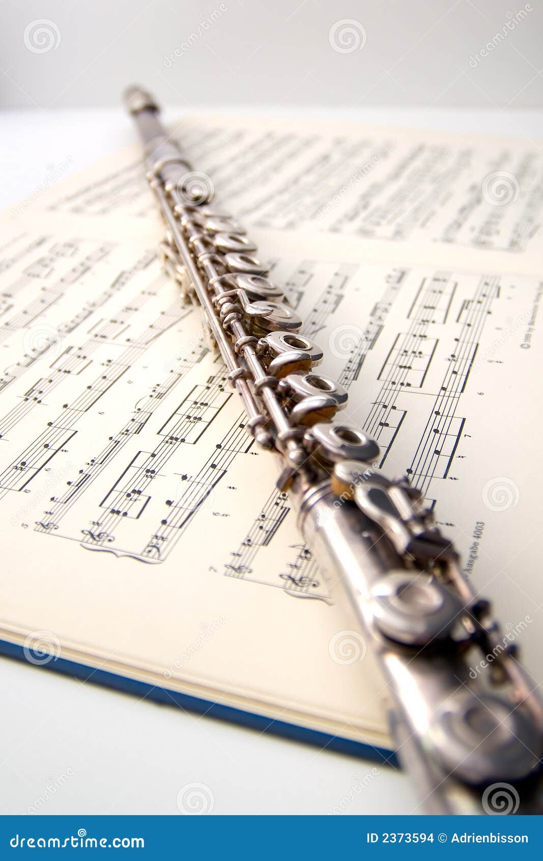 A flute on sheet music stock photo. Image of flautist - 2373594