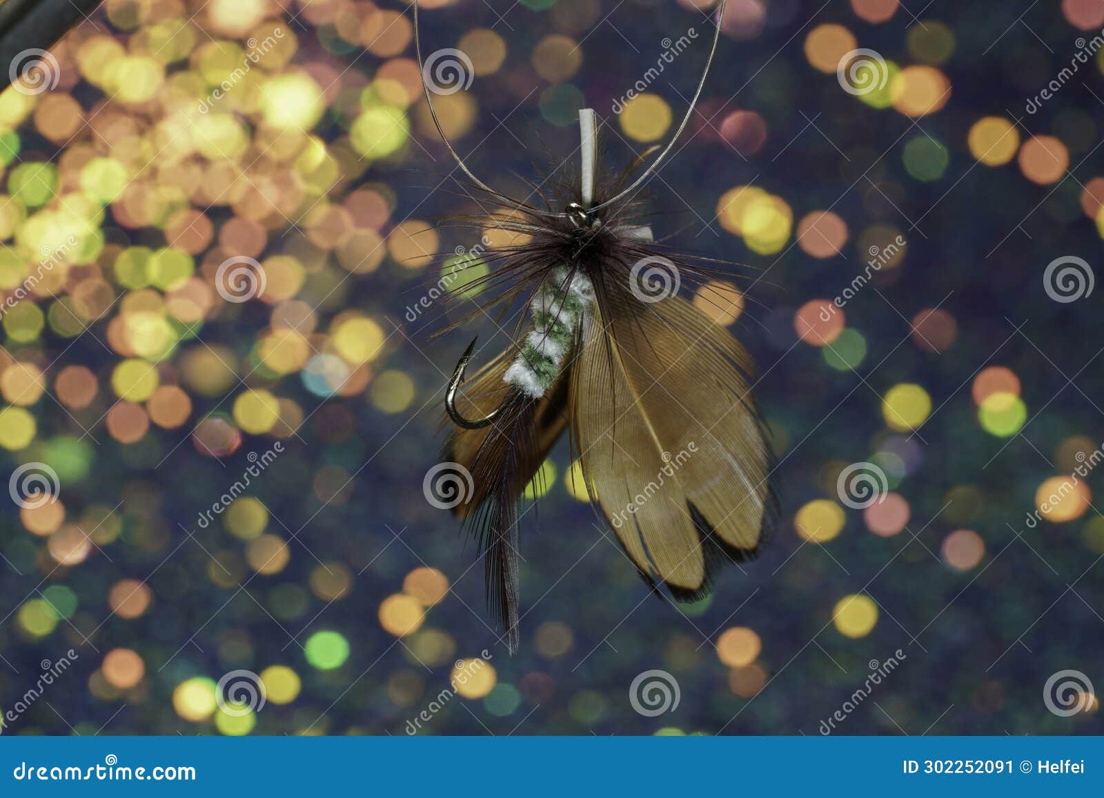 Fly for Fishing on a Background of Colored Bokeh Light Stock Image ...
