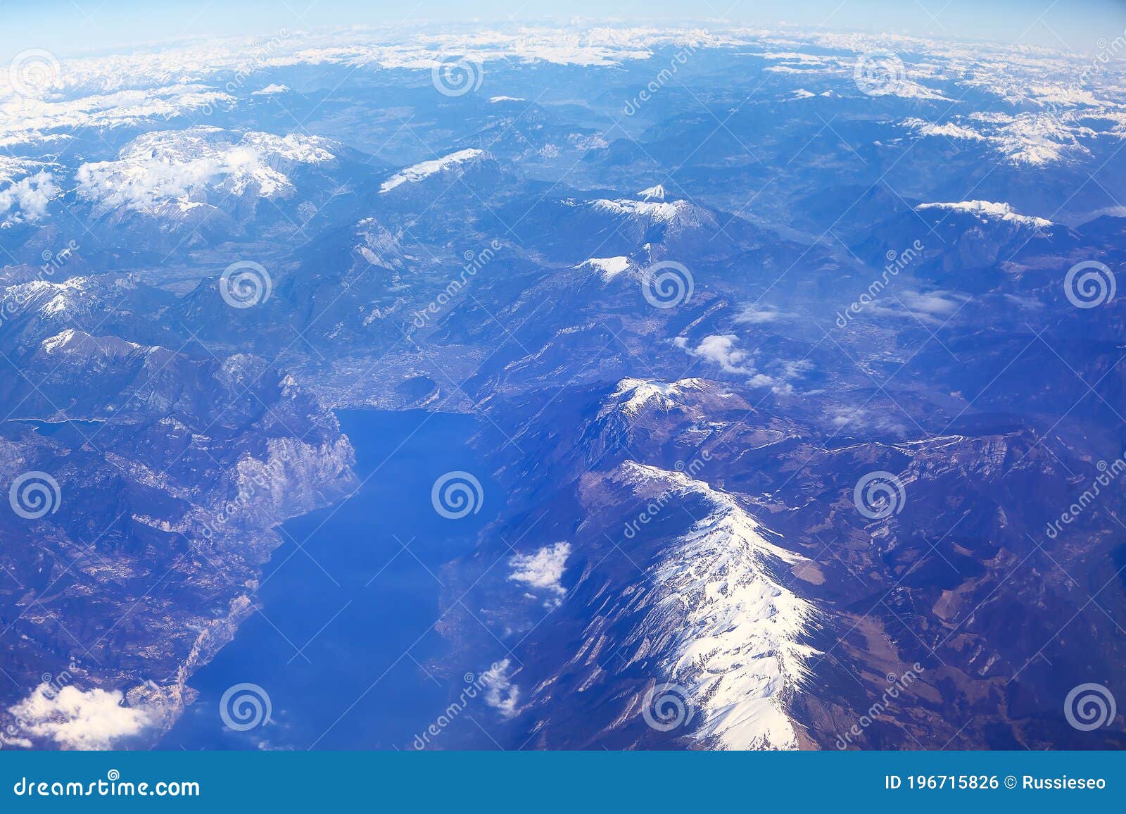 Flying above mountains stock photo. Image of flyover - 196715826