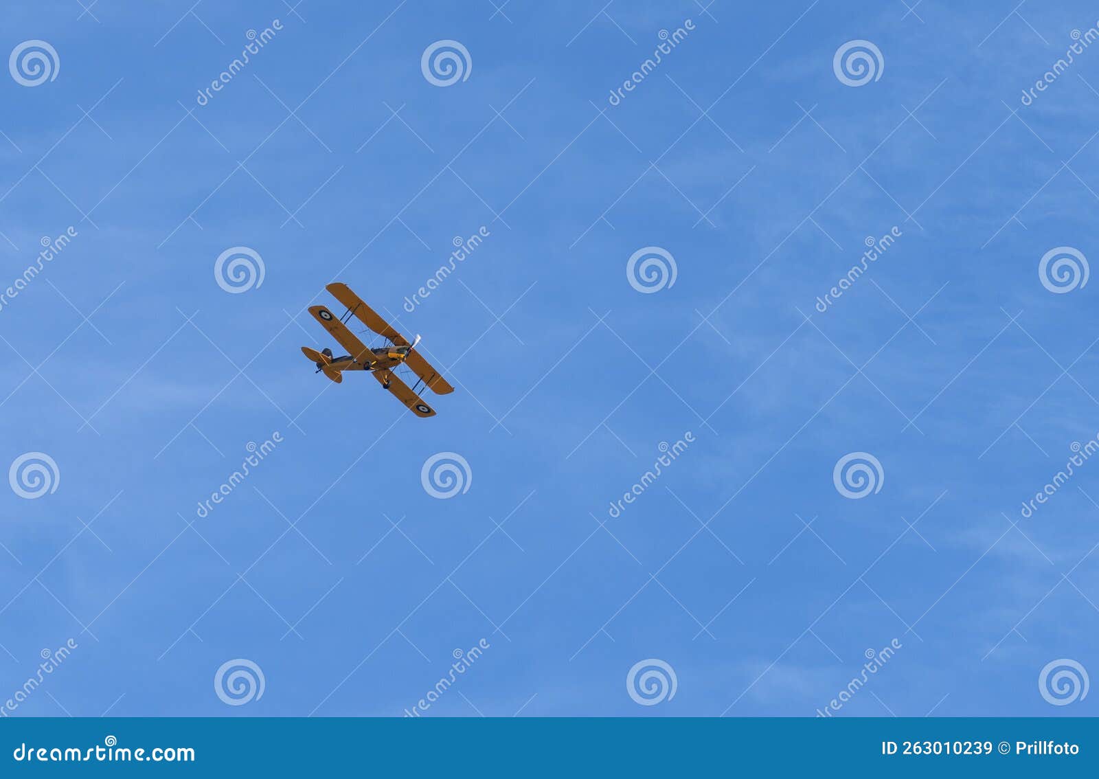 Flying biplane stock image. Image of biplane, blue, sunny - 263010239