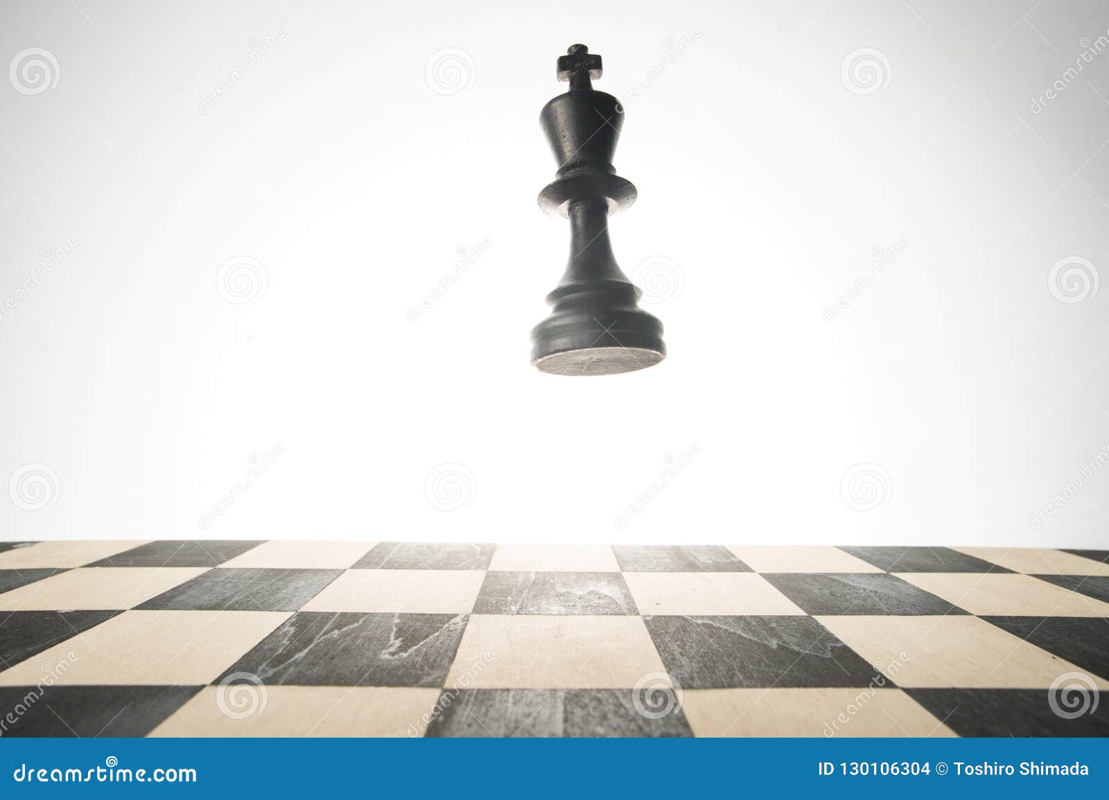 A flying chess piece, king stock photo. Image of simple - 130106304