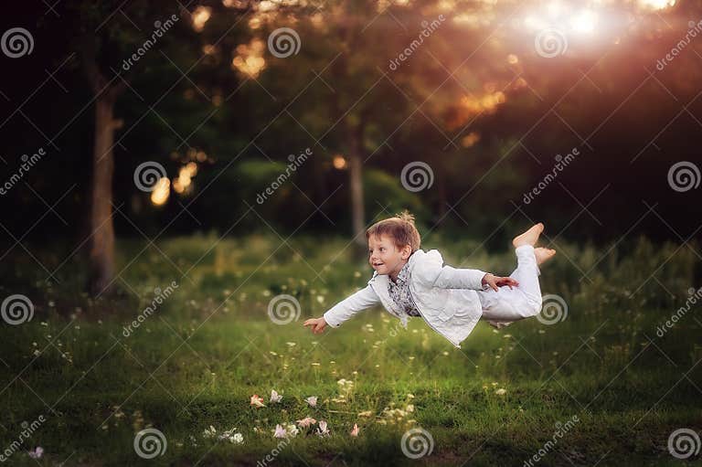 The flying child stock image. Image of outdoors, clothing - 25126105