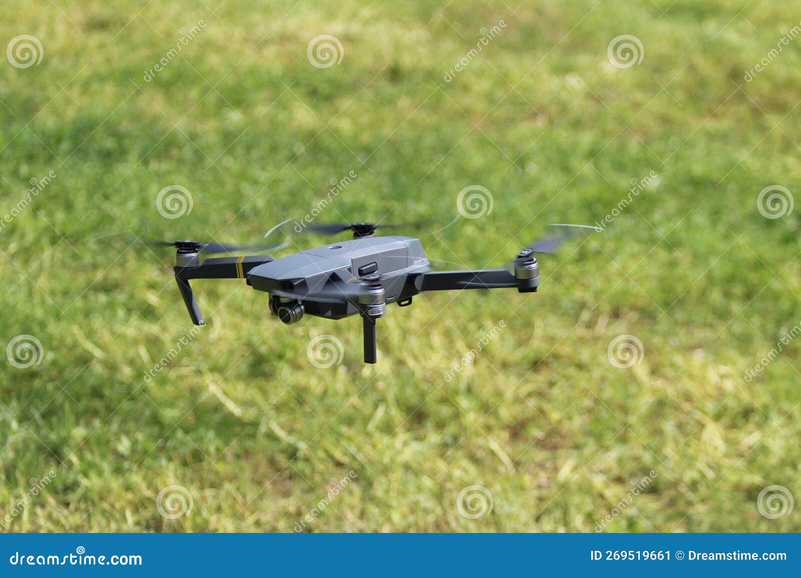 Flying drone over grass stock image. Image of power - 269519661