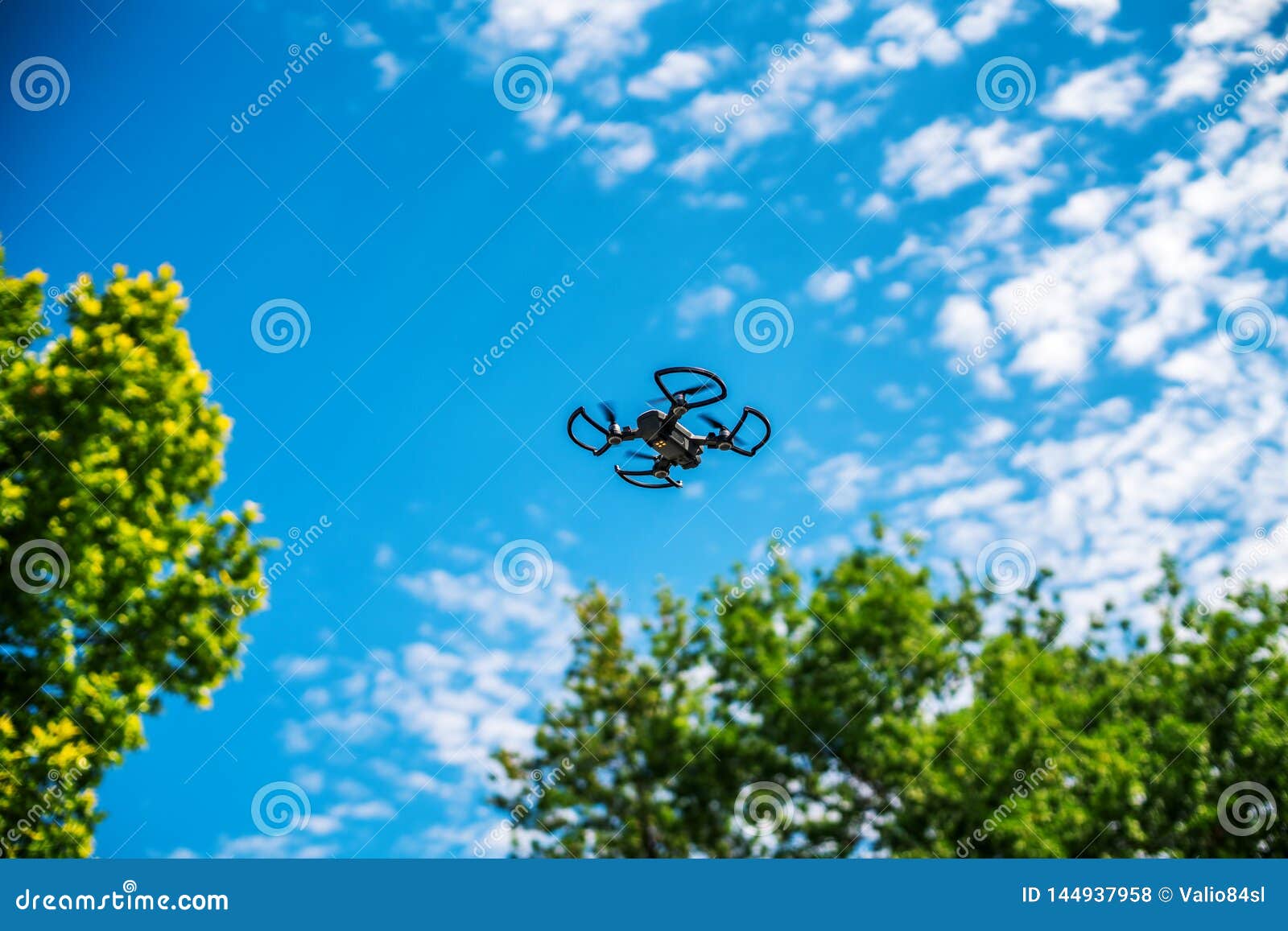 Flying drone over the tree stock photo. Image of helicopter - 144937958
