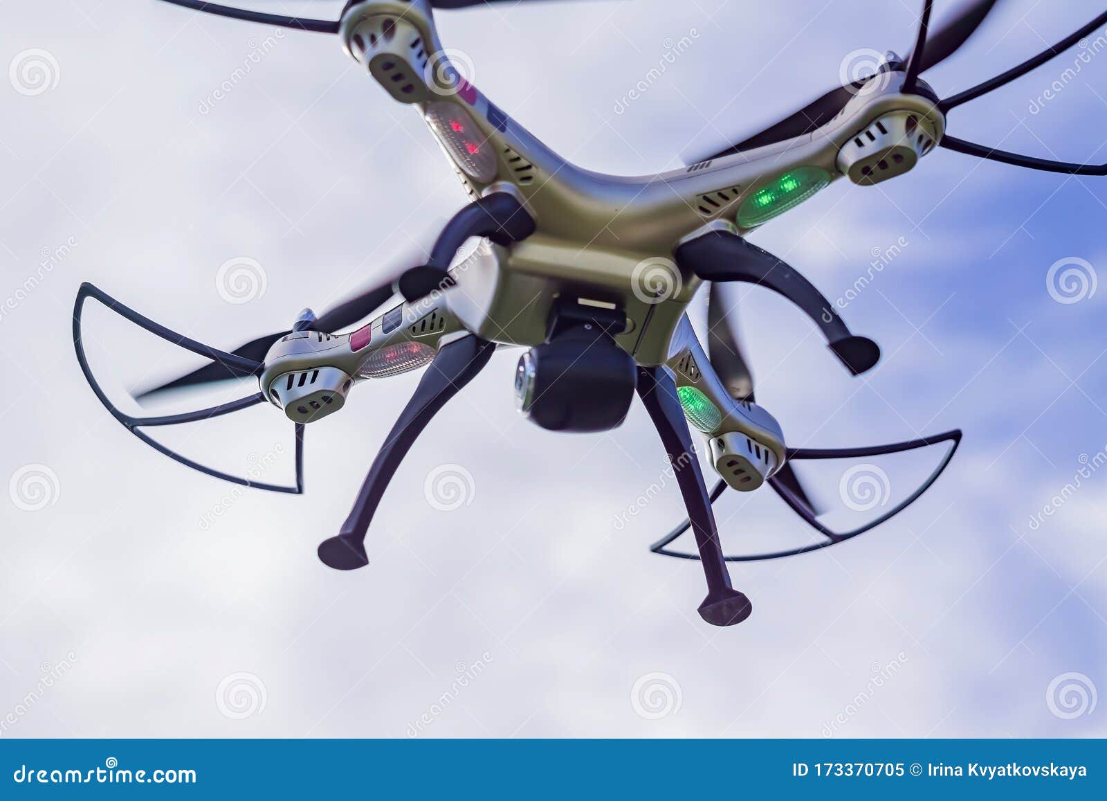 Flying Drone with Remote Control Against Blue Sky Background Stock ...