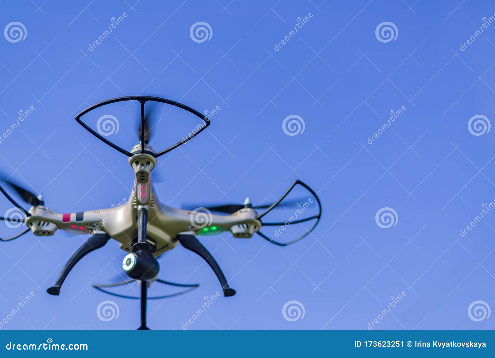 Flying Drone with Remote Control Against Blue Sky Background Stock ...