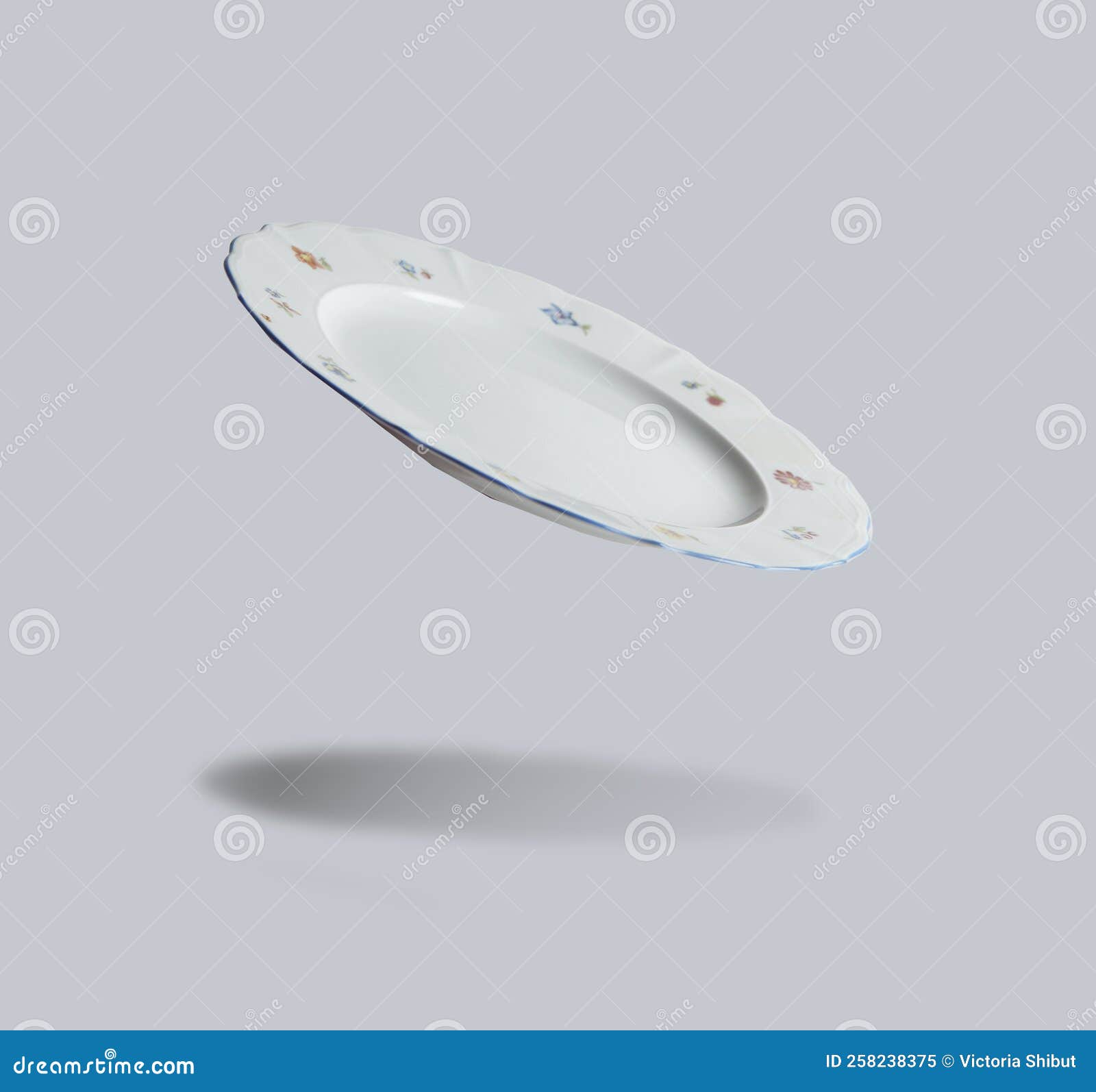 Flying Empty Plate with Shadow at Light Gray Background Stock Image ...