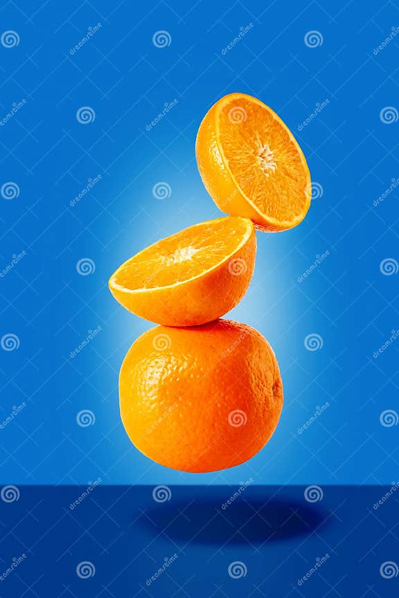 Flying Oranges on Blue Background Stock Photo - Image of stack, group ...