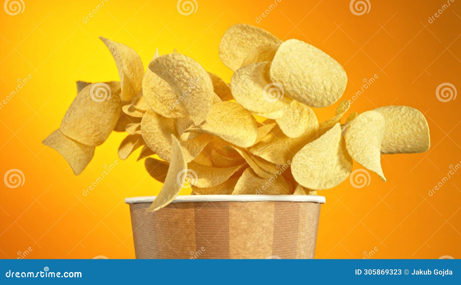 Flying Fried Potato Chips Exploding from Paper Bucket. Stock Image ...