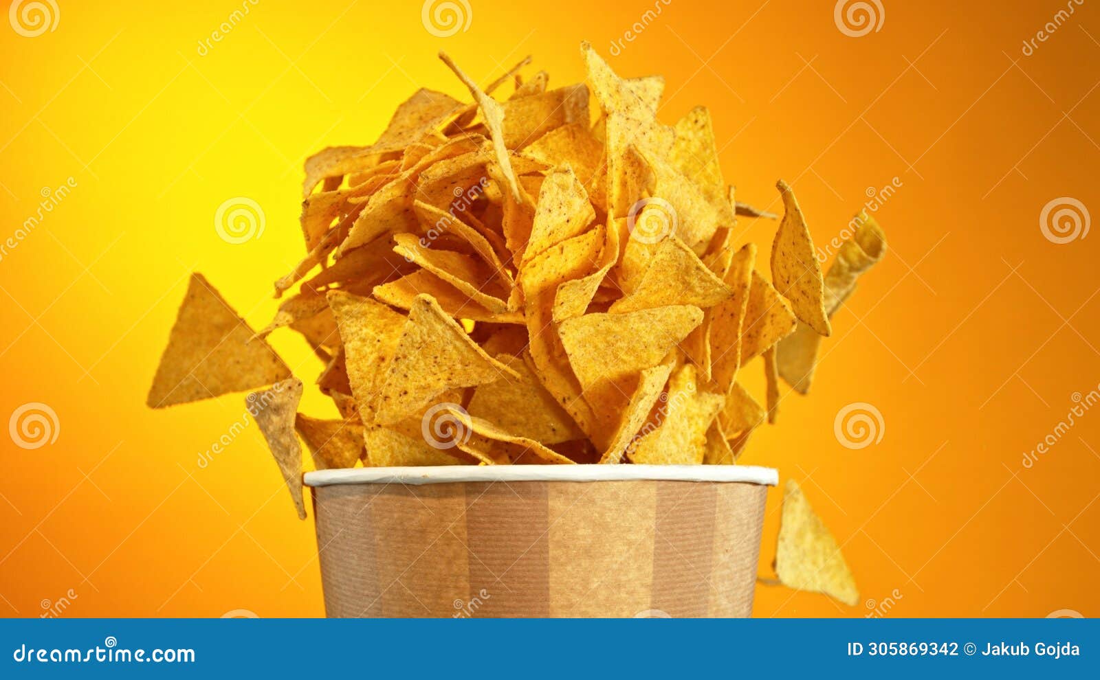 Flying Fried Tortilla Chips Exploding from Paper Bucket. Stock Photo ...