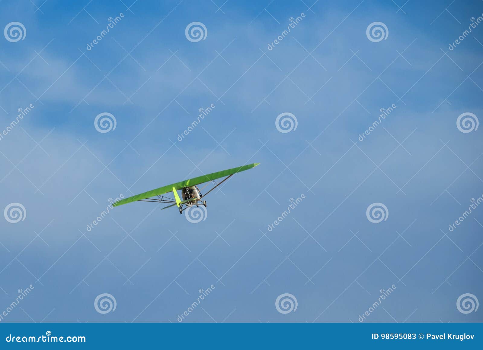 A Flying Hang-glider on the Background of a Blue Sky Stock Image ...