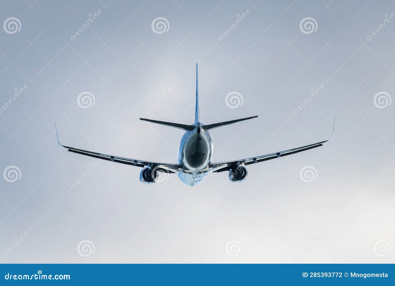 Flying Jet Passenger Plane in the Sky, Rear View Stock Photo - Image of ...