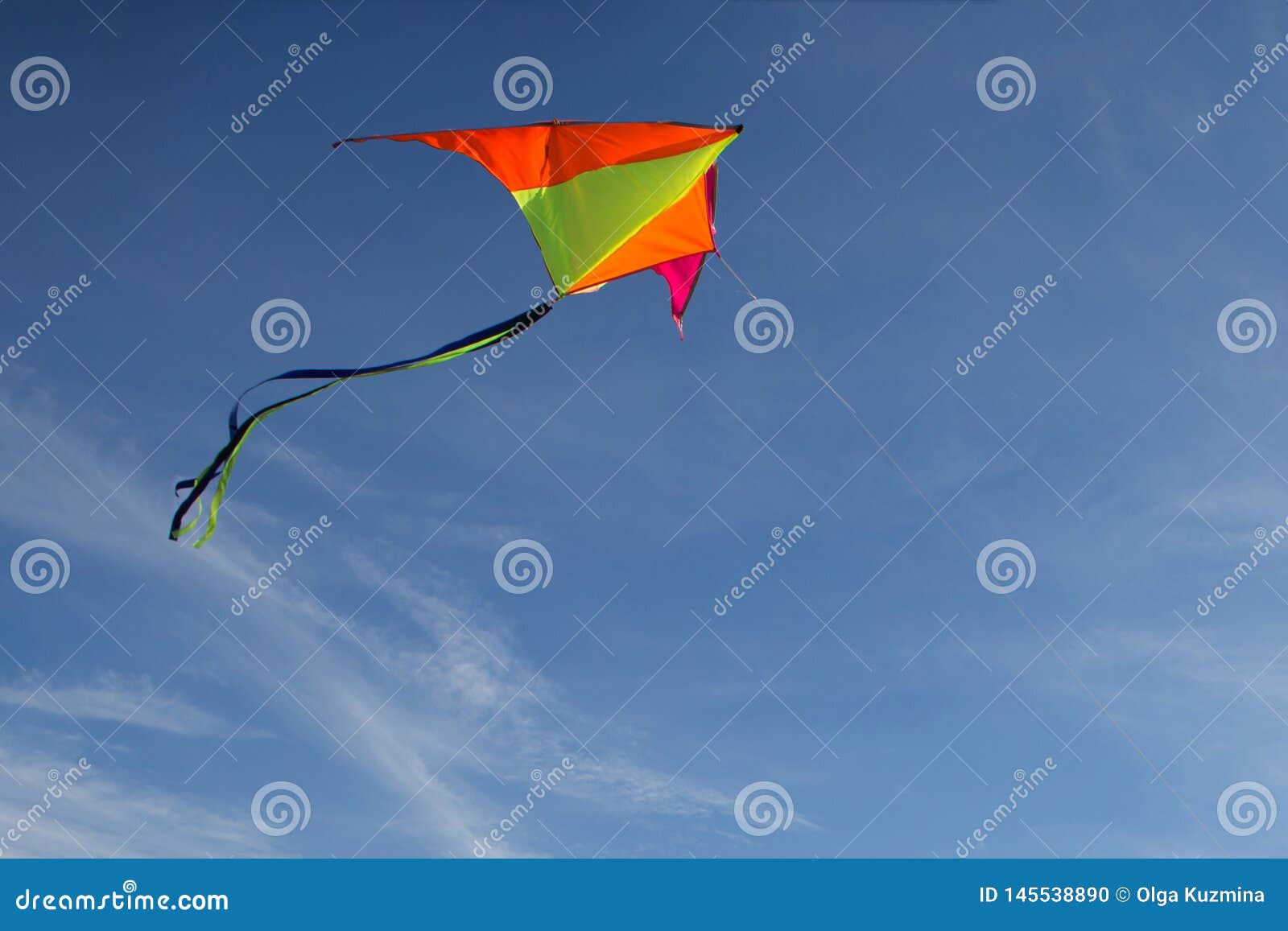 Flying a Kite. Bright Kite Against the Blue Sky Stock Photo - Image of ...