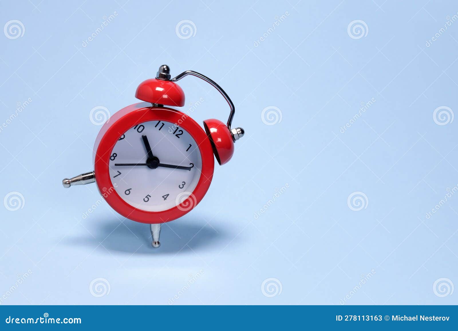Flying Levitating Red Alarm Clock on a Blue Background Close-up Stock ...