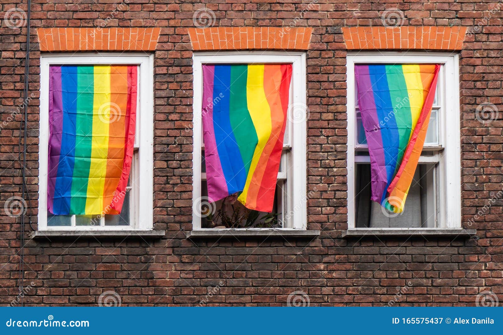 Flying Lgbtq Flags Hanging from Three Windows Stock Image - Image of ...
