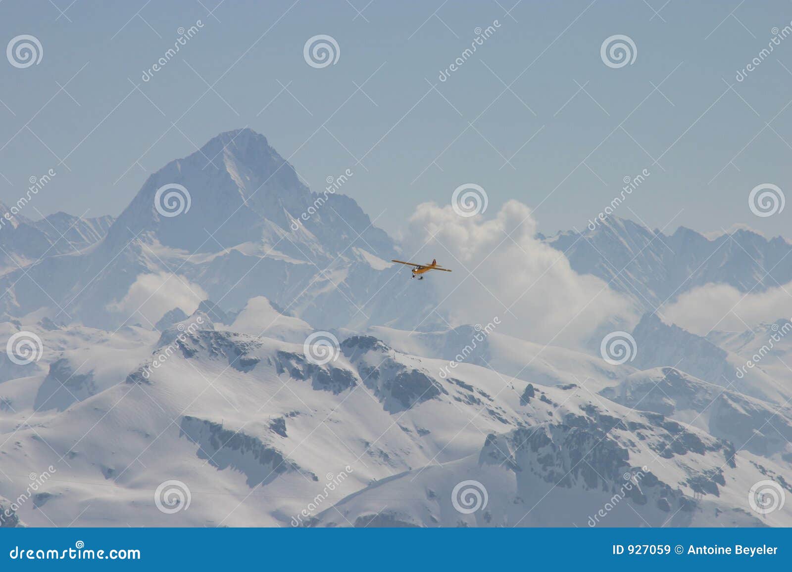 Flying in the mountains stock image. Image of airplane - 927059