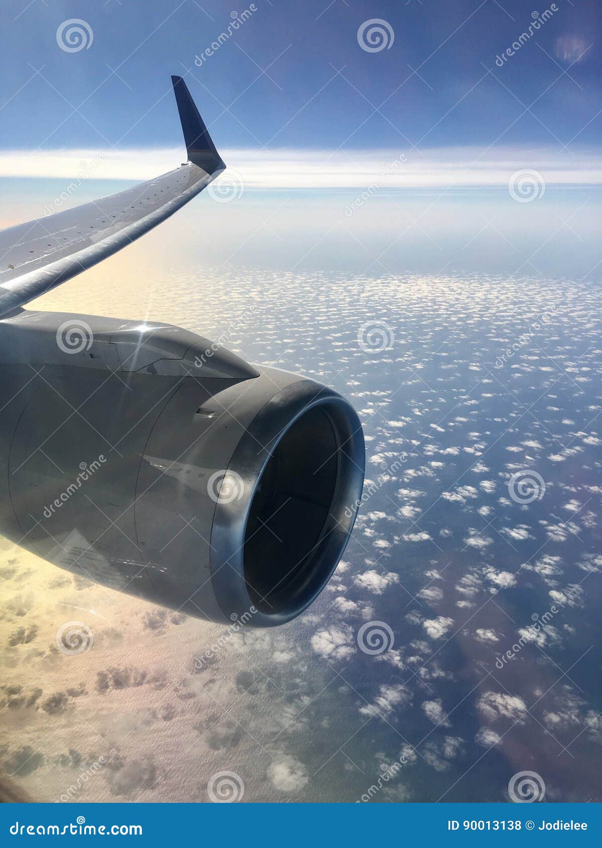 Flying Over the Ocean View of Aircraft Wing and Clouds Stock Photo ...