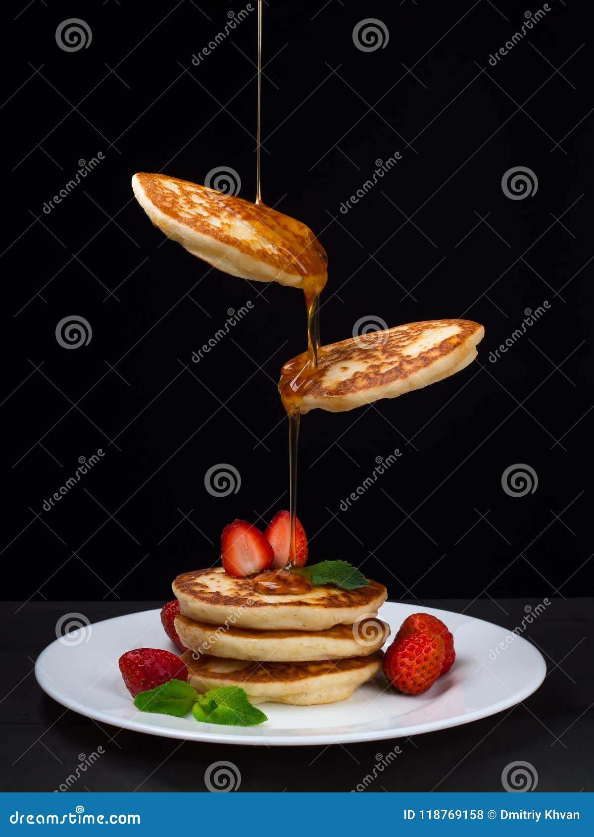 Flying Pancakes with Honey and Strawberries. Stock Photo - Image of ...