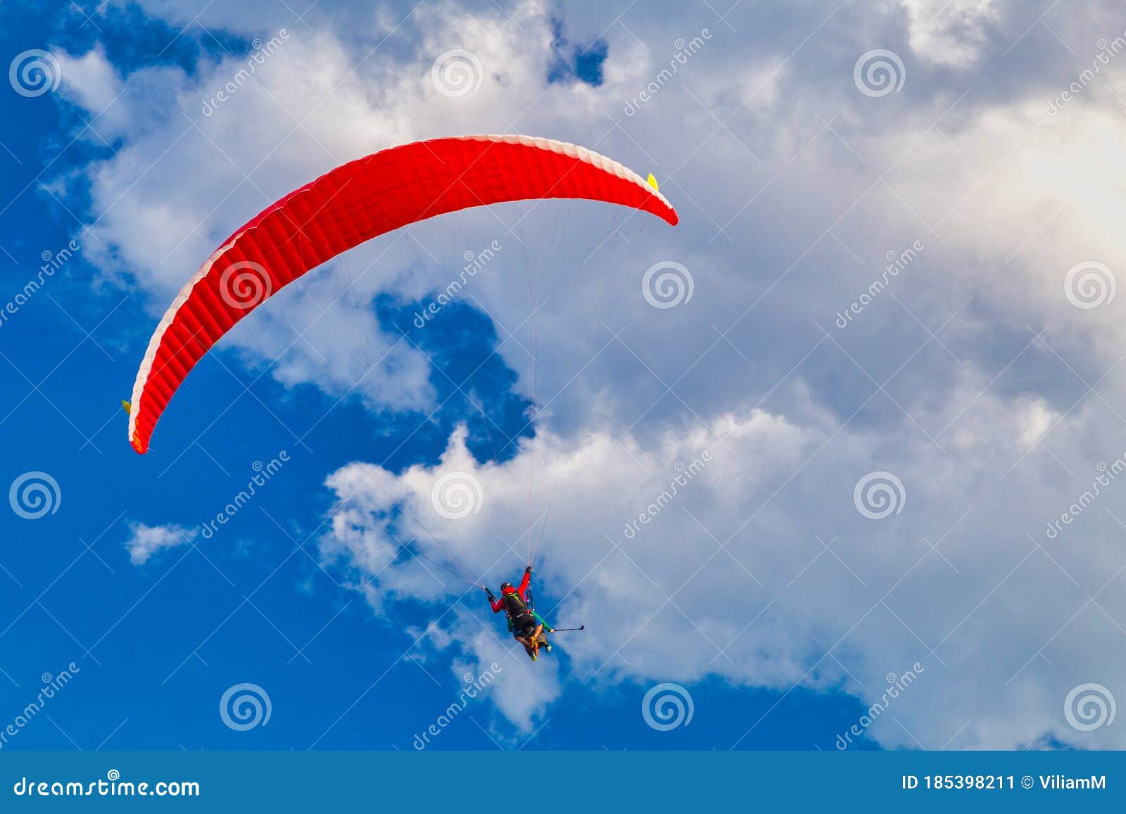Flying Paraglider on a Blue Sky with Clouds Stock Image - Image of ...