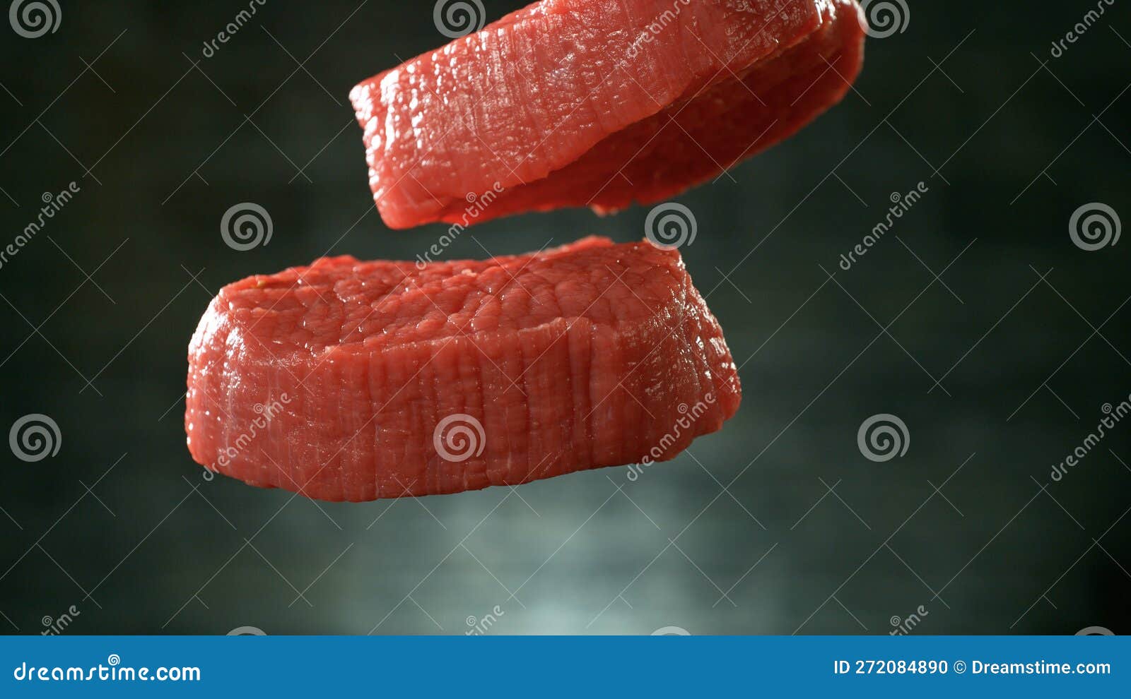 Flying Pieces of Raw Beef Steaks Falling on Table Stock Photo - Image ...