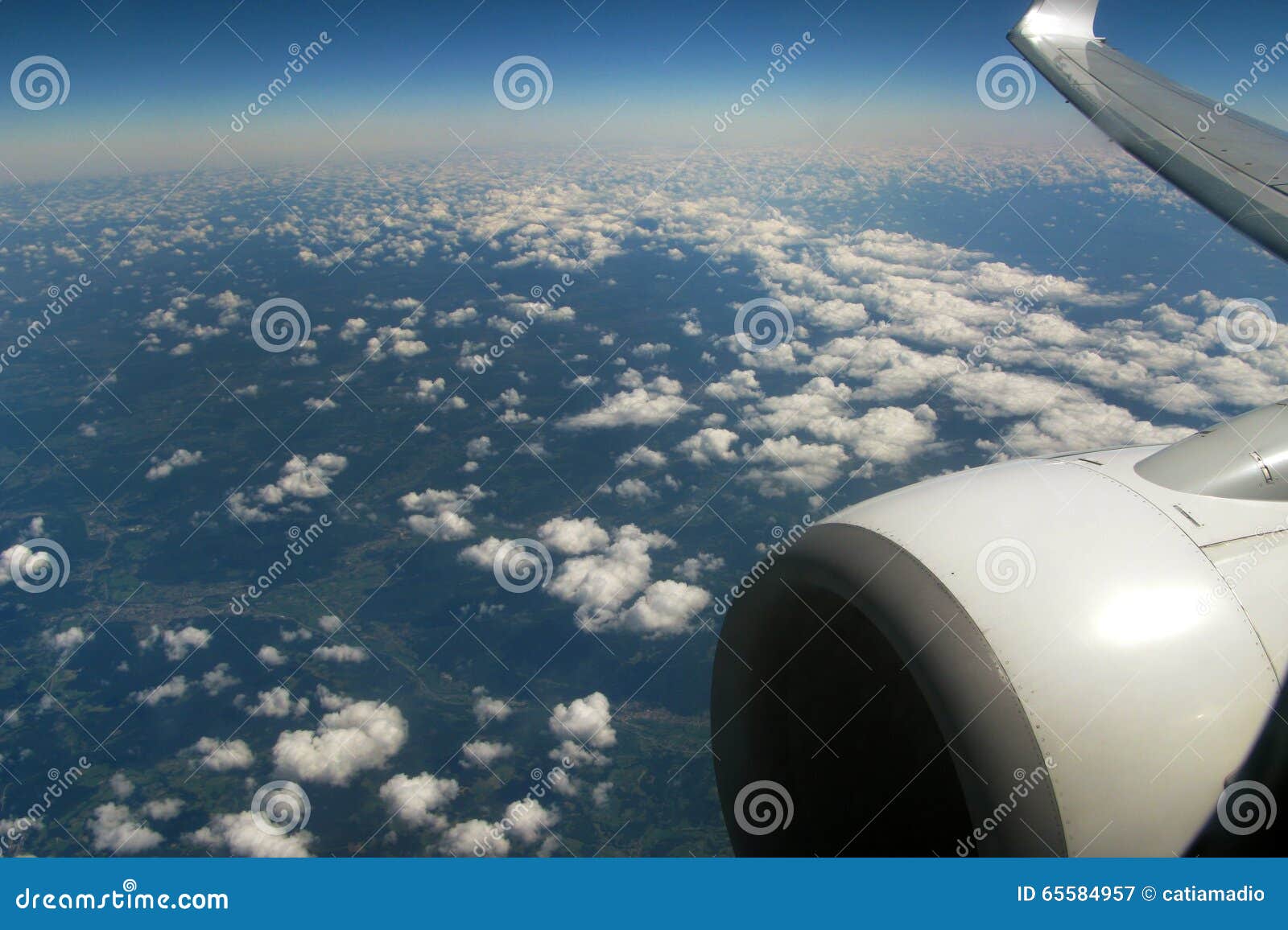Flying plane over clouds stock image. Image of view, ground - 65584957