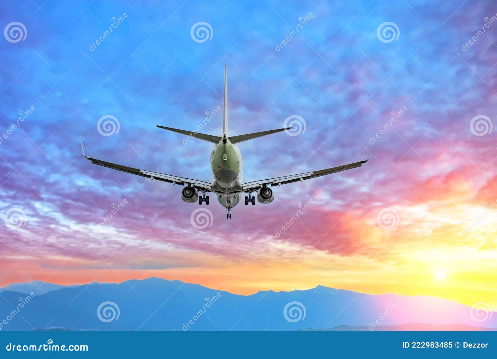 Flying Plane Over the Mountains during a Beautiful Sunset Stock Image ...